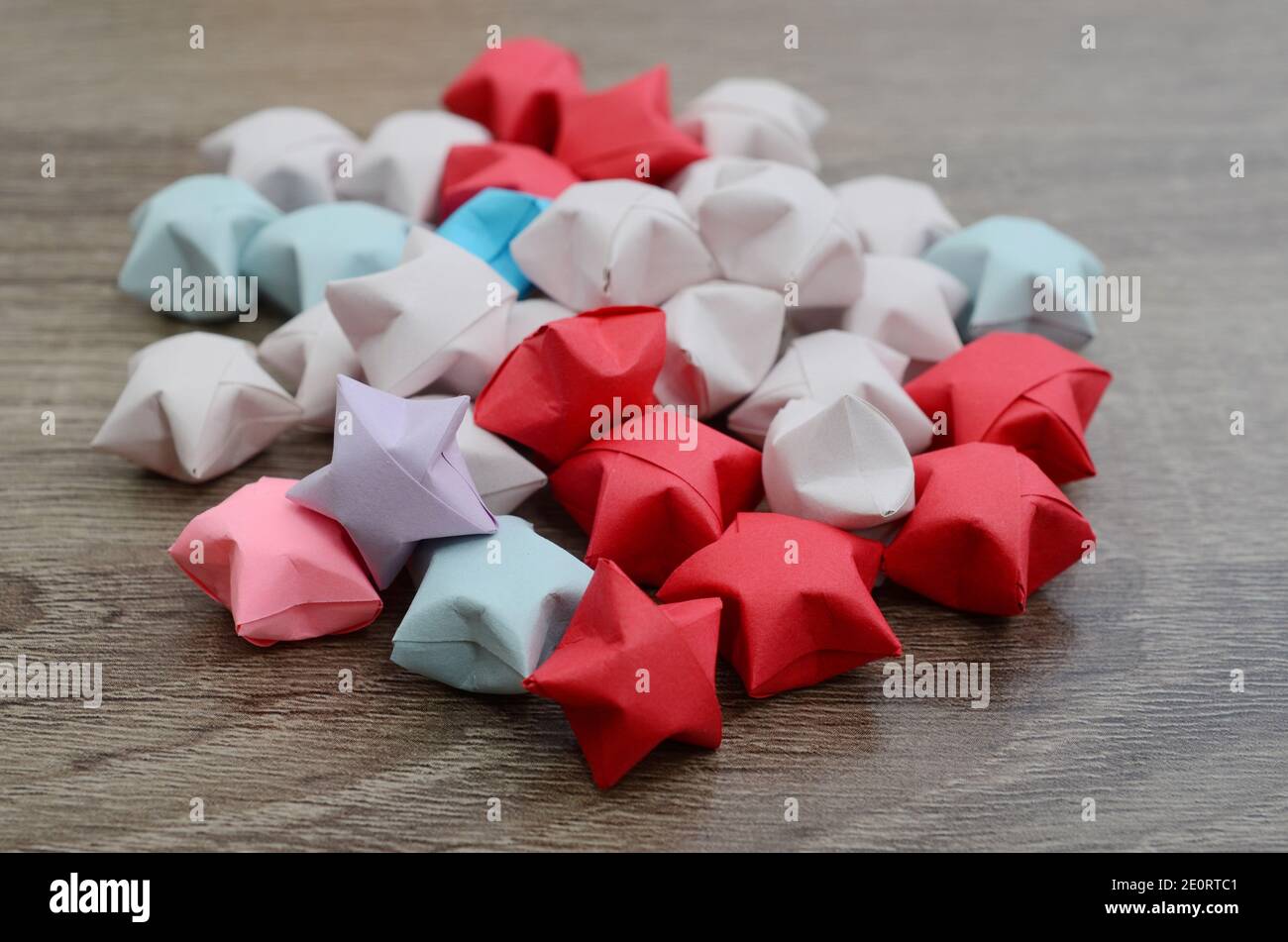 Variety of colored origami paper stars pile Stock Photo - Alamy