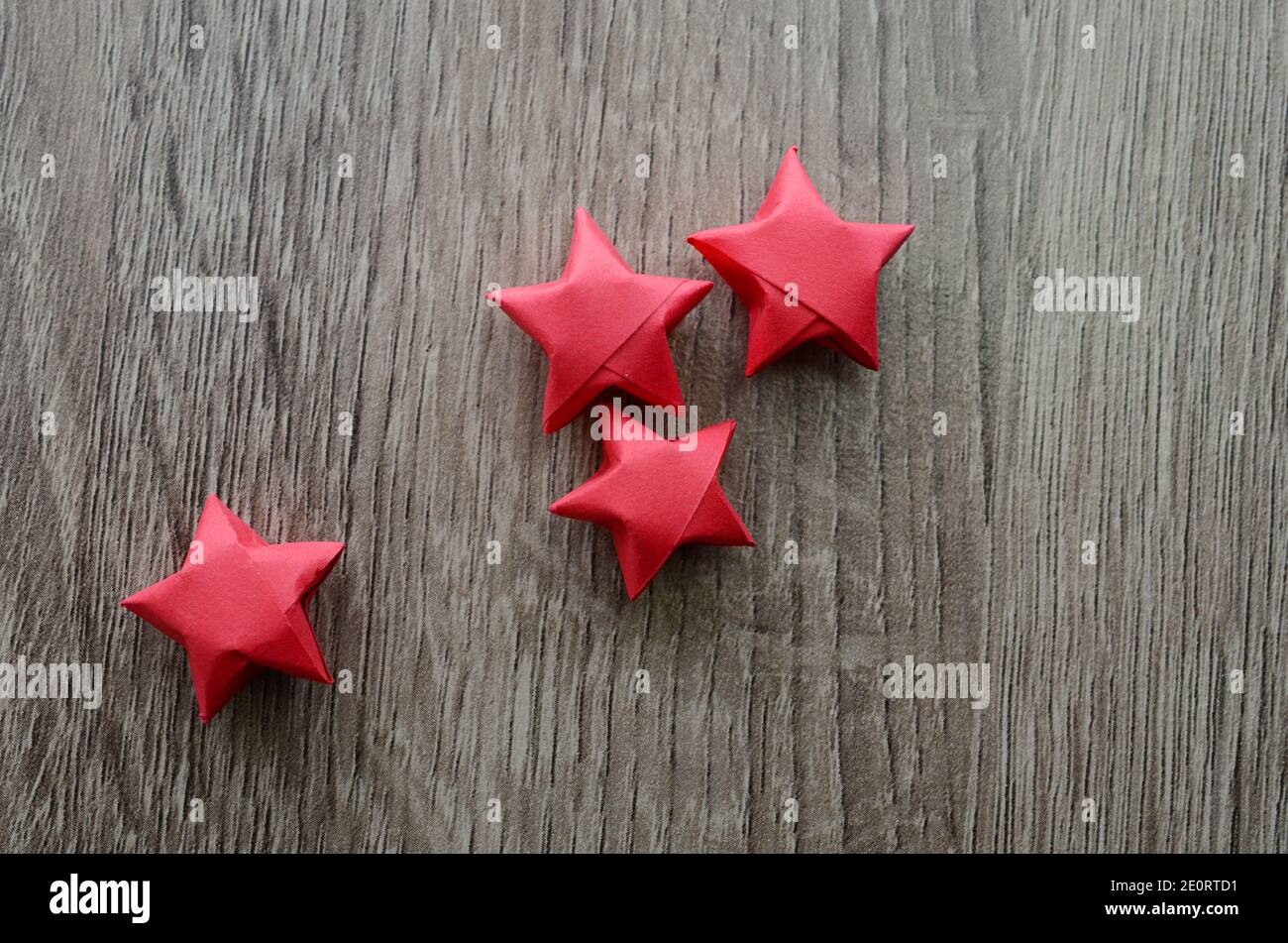 Colorful red origami lucky paper stars Stock Photo - Alamy