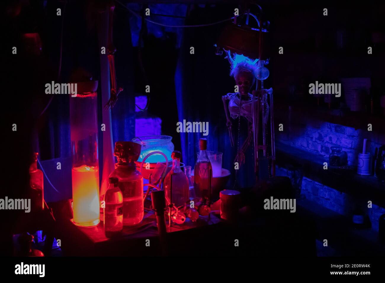 Scary laboratory with skeleton and retro glass in dark red and blue ...