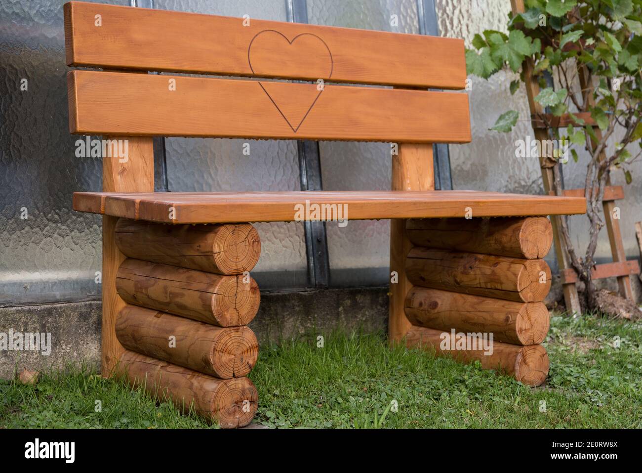 Solid Wood Bench With Engraved Heart For Lovers In The Garden Stock ...