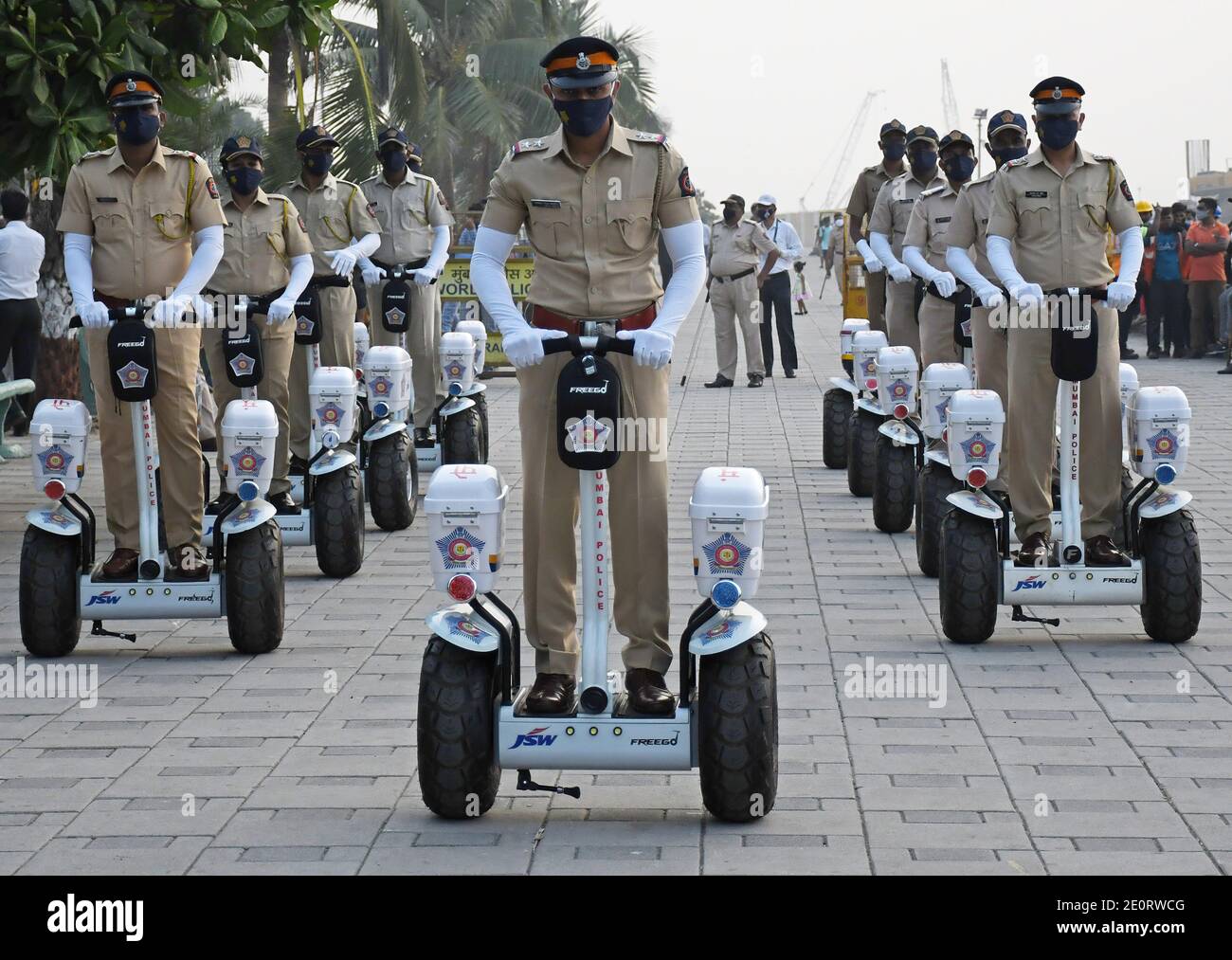 Police personnel practice riding the Segway before the launch. Segway ...
