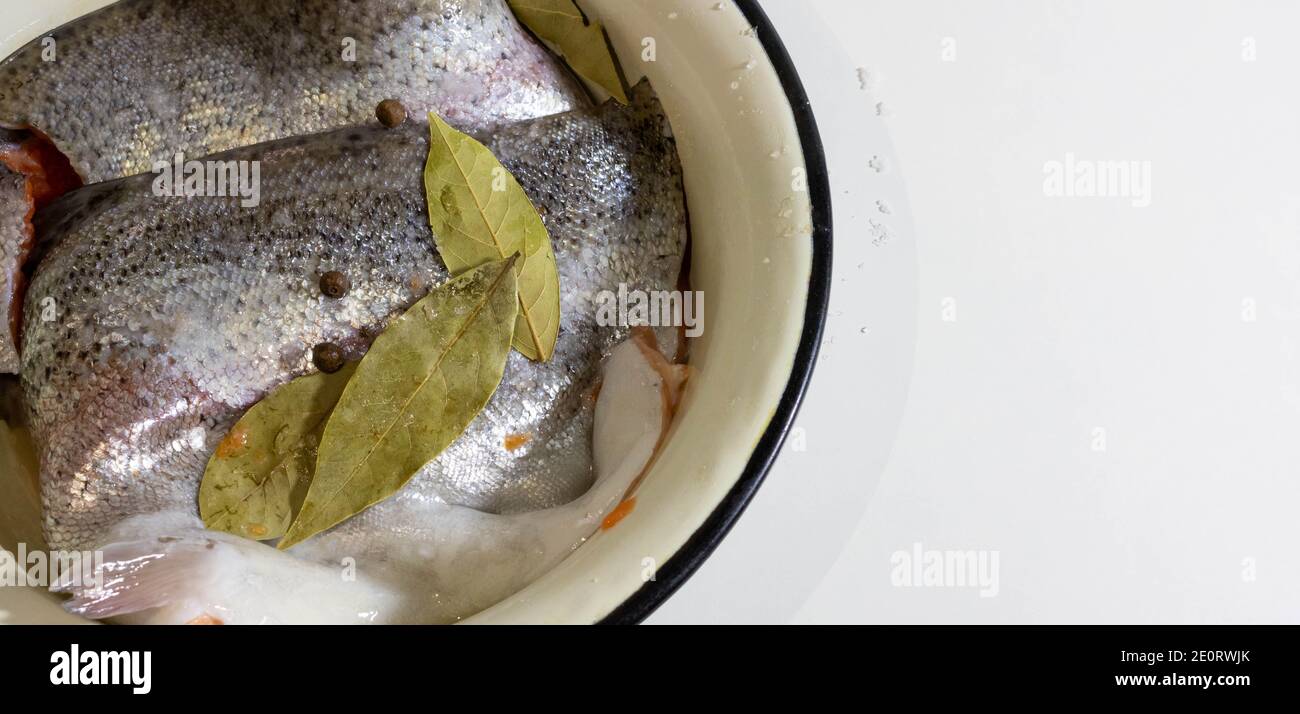 Salting fresh trout. Pieces of salted trout with salt Stock Photo - Alamy