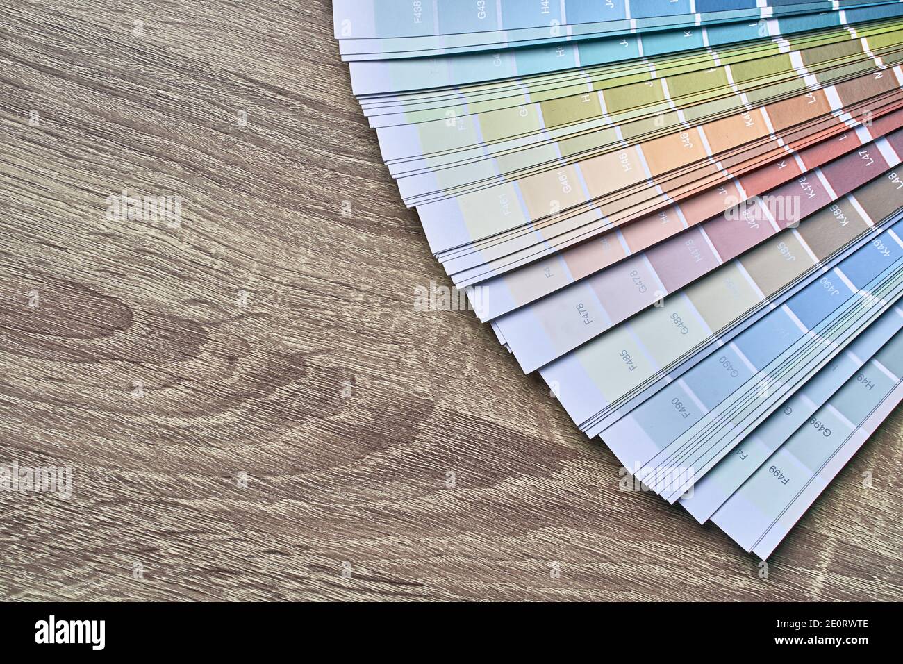 Color wheel palette for choosing paint tone. Various colors on wooden ...