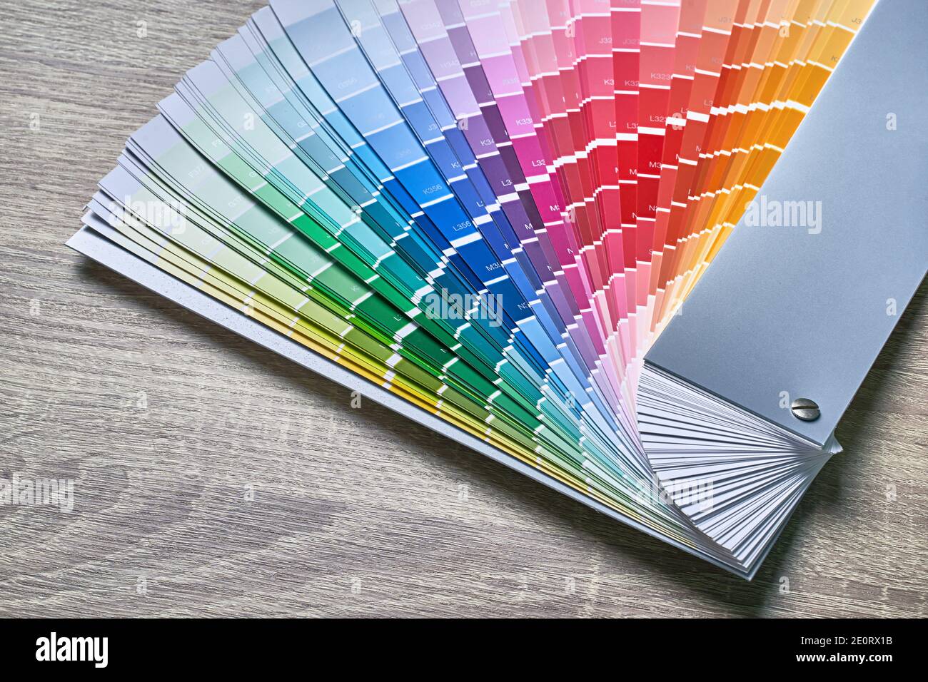 Color wheel palette for choosing paint tone. Various colors on wooden ...