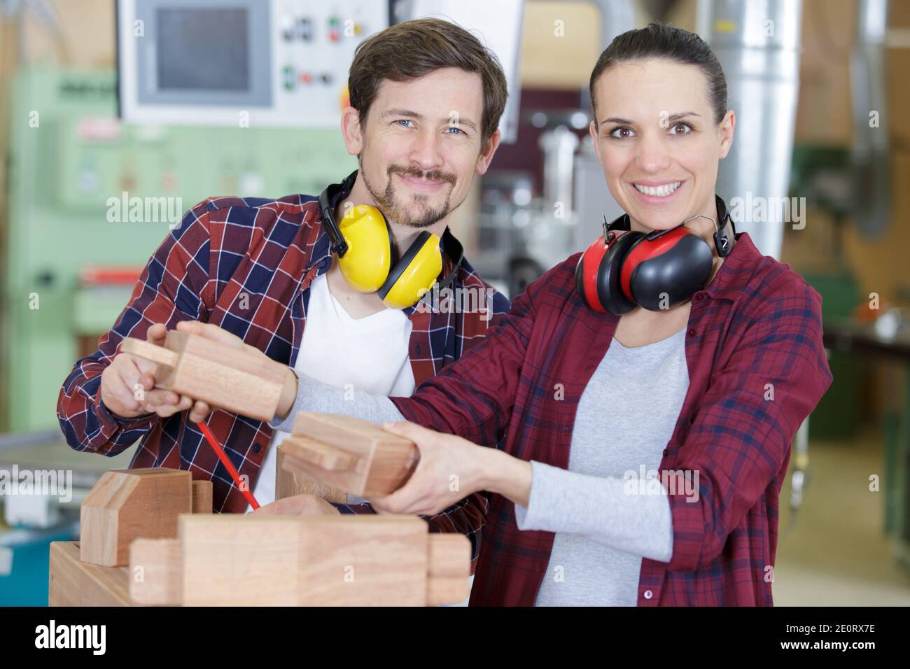 woman an man smiling in a factory Stock Photo - Alamy