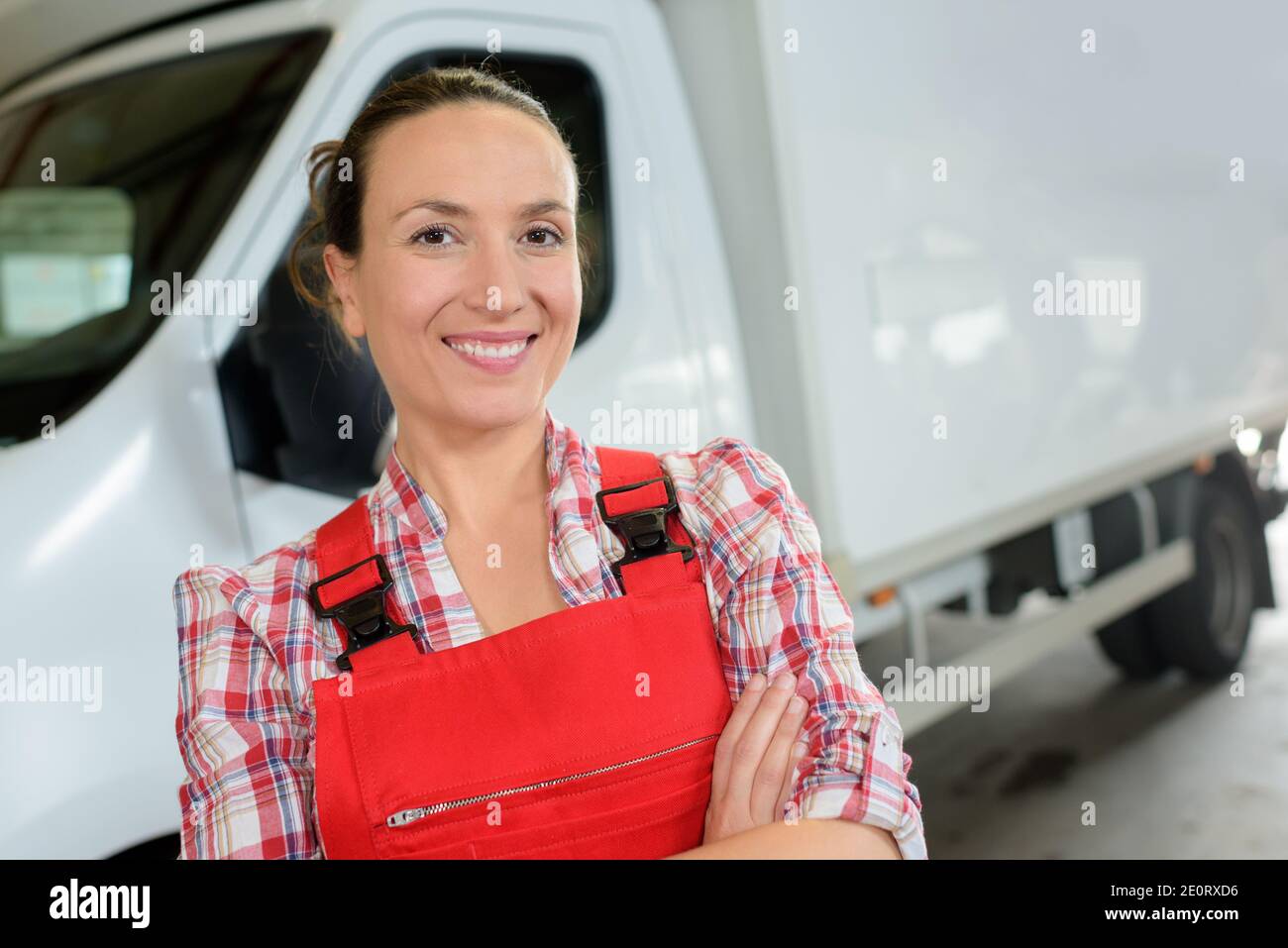 female mechanic looking at camera Stock Photo - Alamy