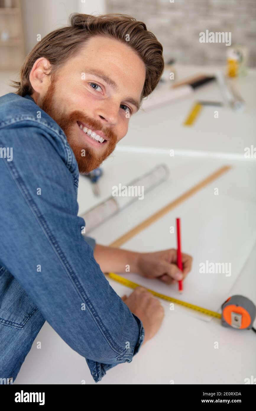 Male carpenter marking wood pen hi-res stock photography and images - Alamy