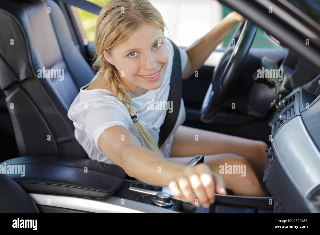 beautiful woman opening car door Stock Photo - Alamy
