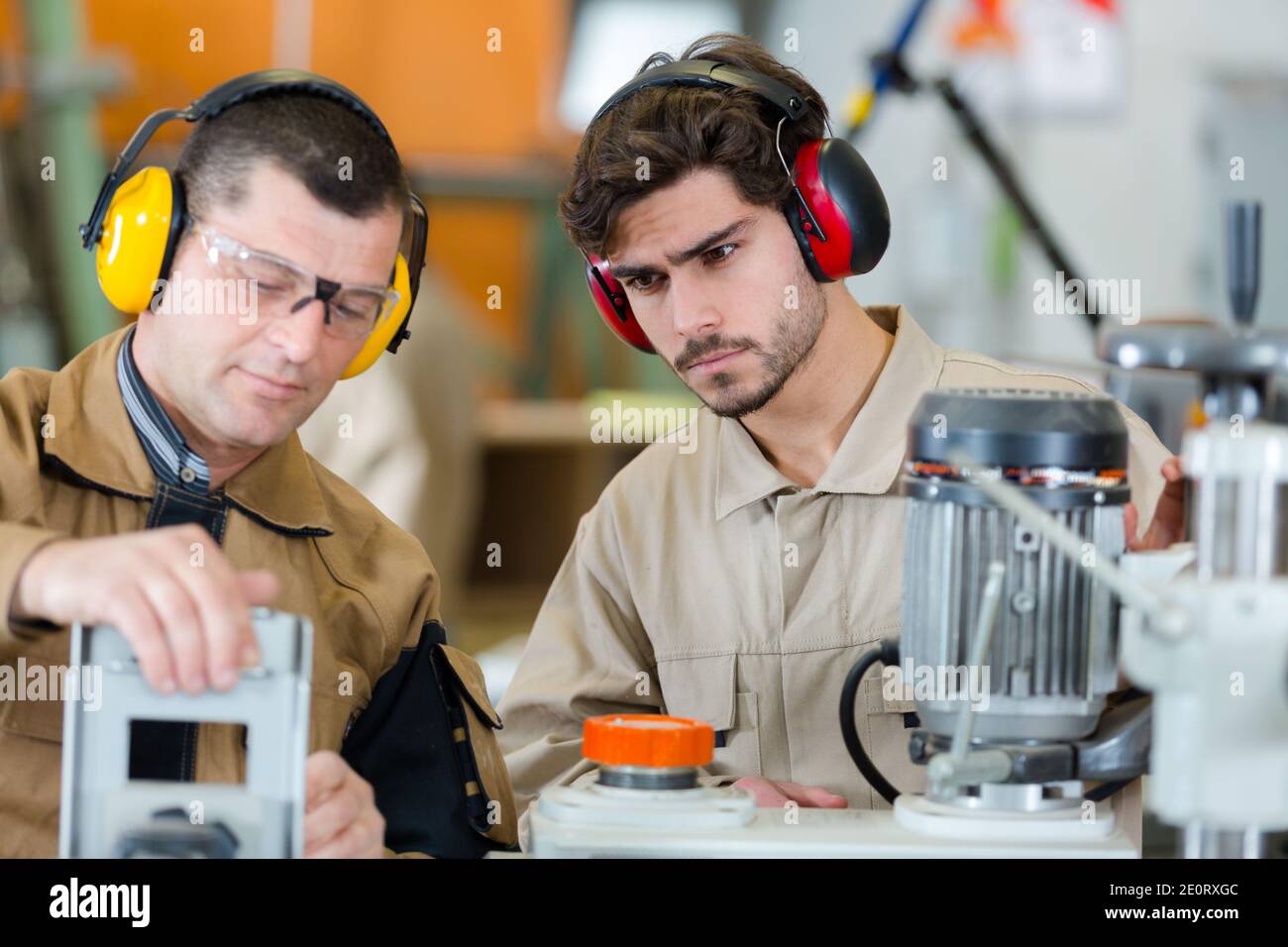 two men using industrial machinery Stock Photo - Alamy