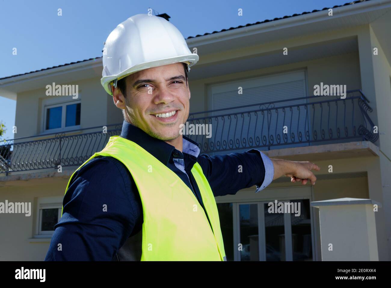 architect pointing towards residential property from outdoors Stock ...