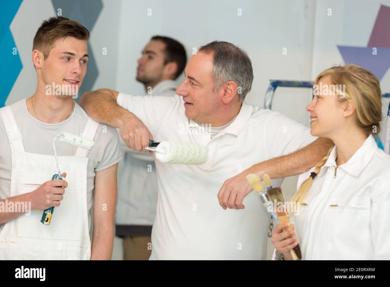 happy decorating team Stock Photo - Alamy