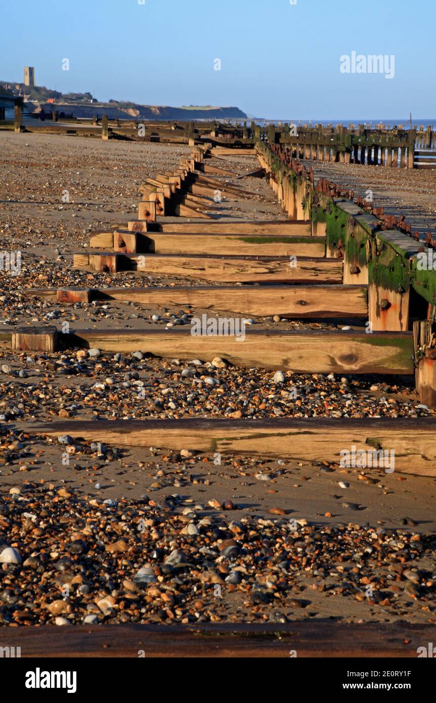 The remains of the base of timber sea defences revealed at low water on ...