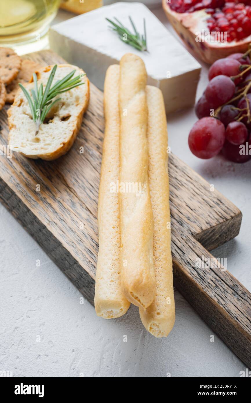 Breadsticks, with olive oil, on white background Stock Photo - Alamy