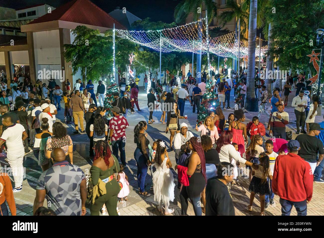 Large crowd celebrating the new year of 2021 on the boardwalk in the ...