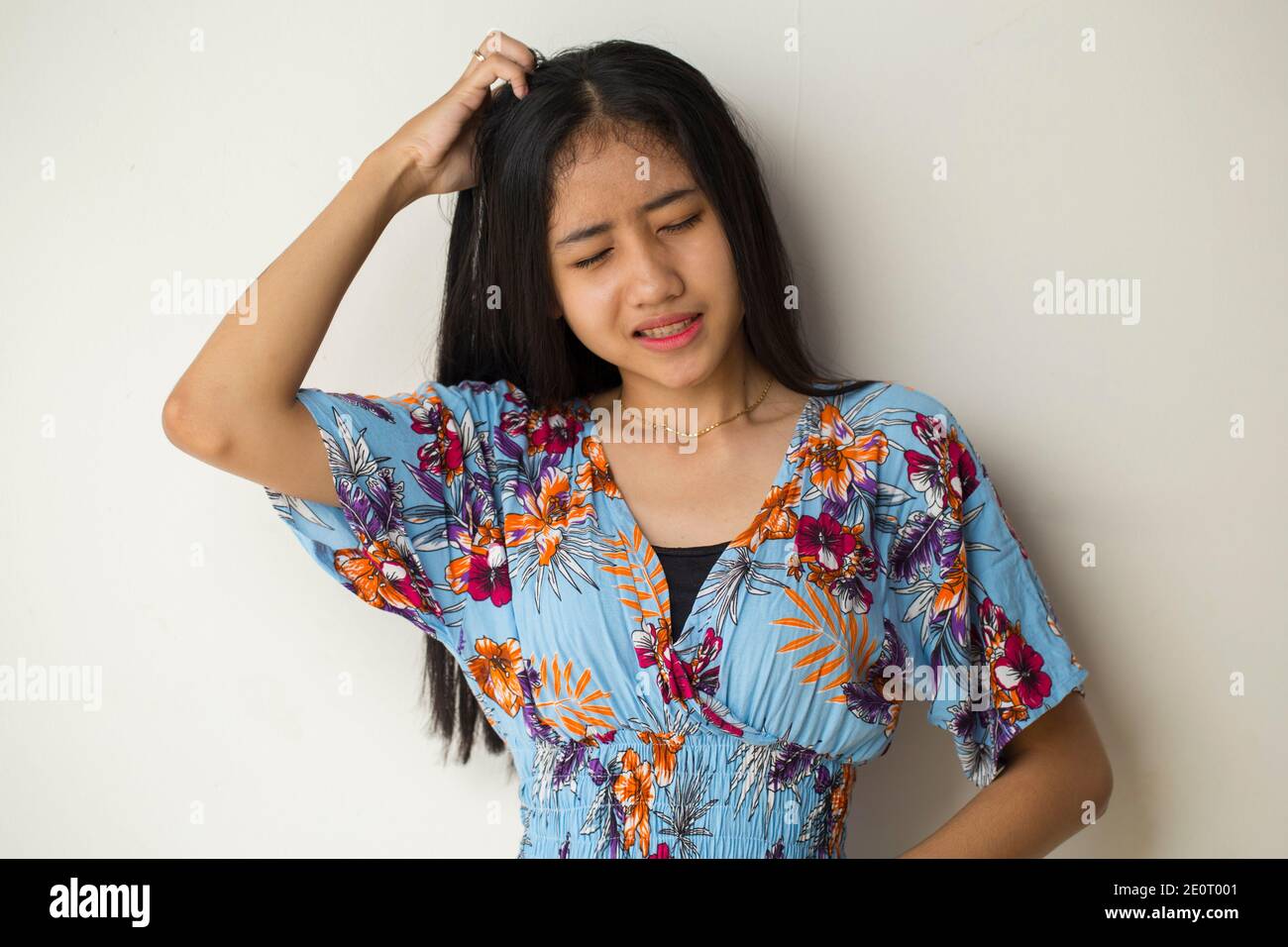 Closeup portrait of asian young woman scratching head with hand Stock ...