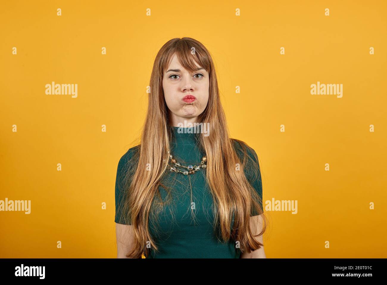 Woman blowing cheeks hi-res stock photography and images - Alamy