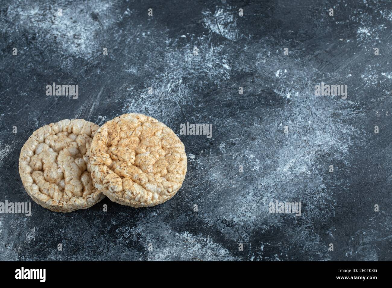 Organic round crispbread on marble background Stock Photo - Alamy