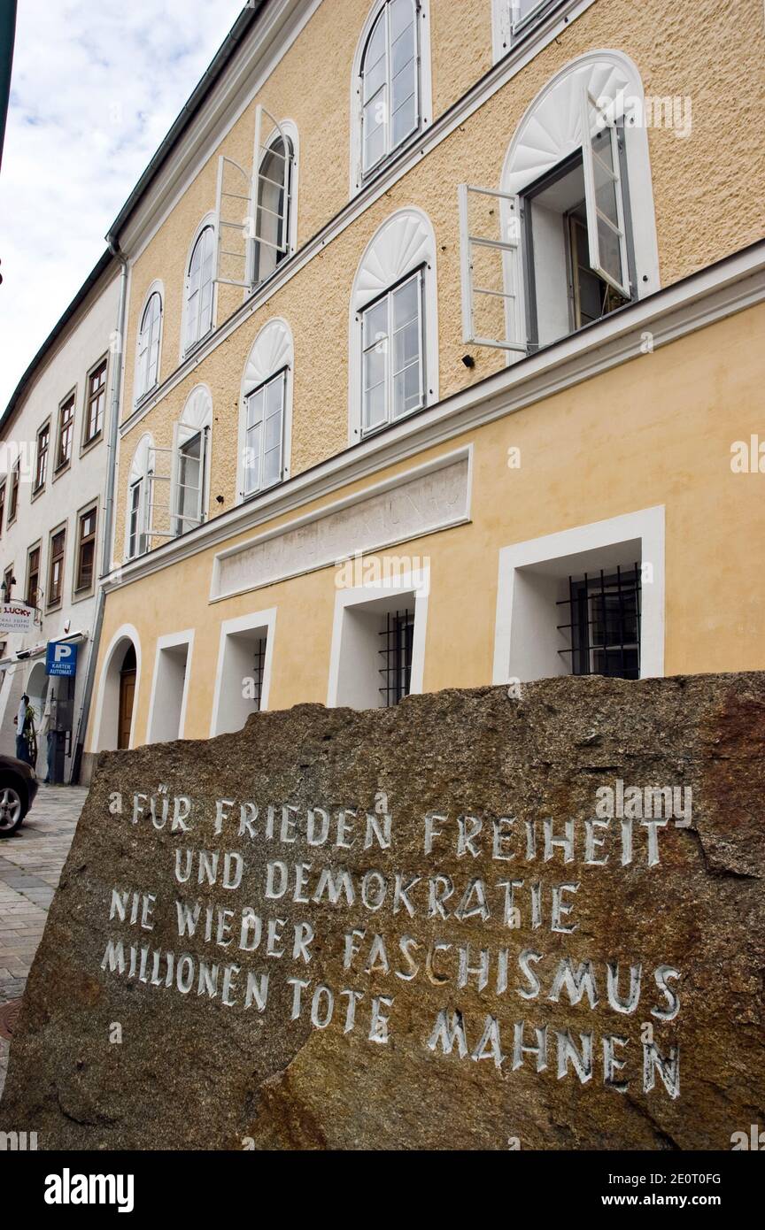 A memorial stone outside the building where Adolf Hitler was born in ...