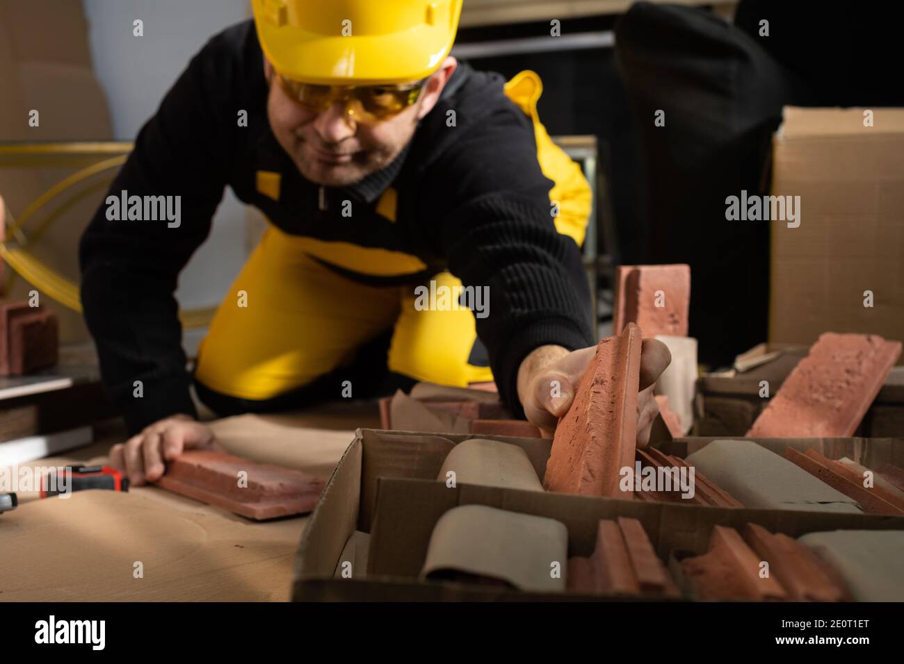 Every now and then a manual worker reaches for the next element of the ...