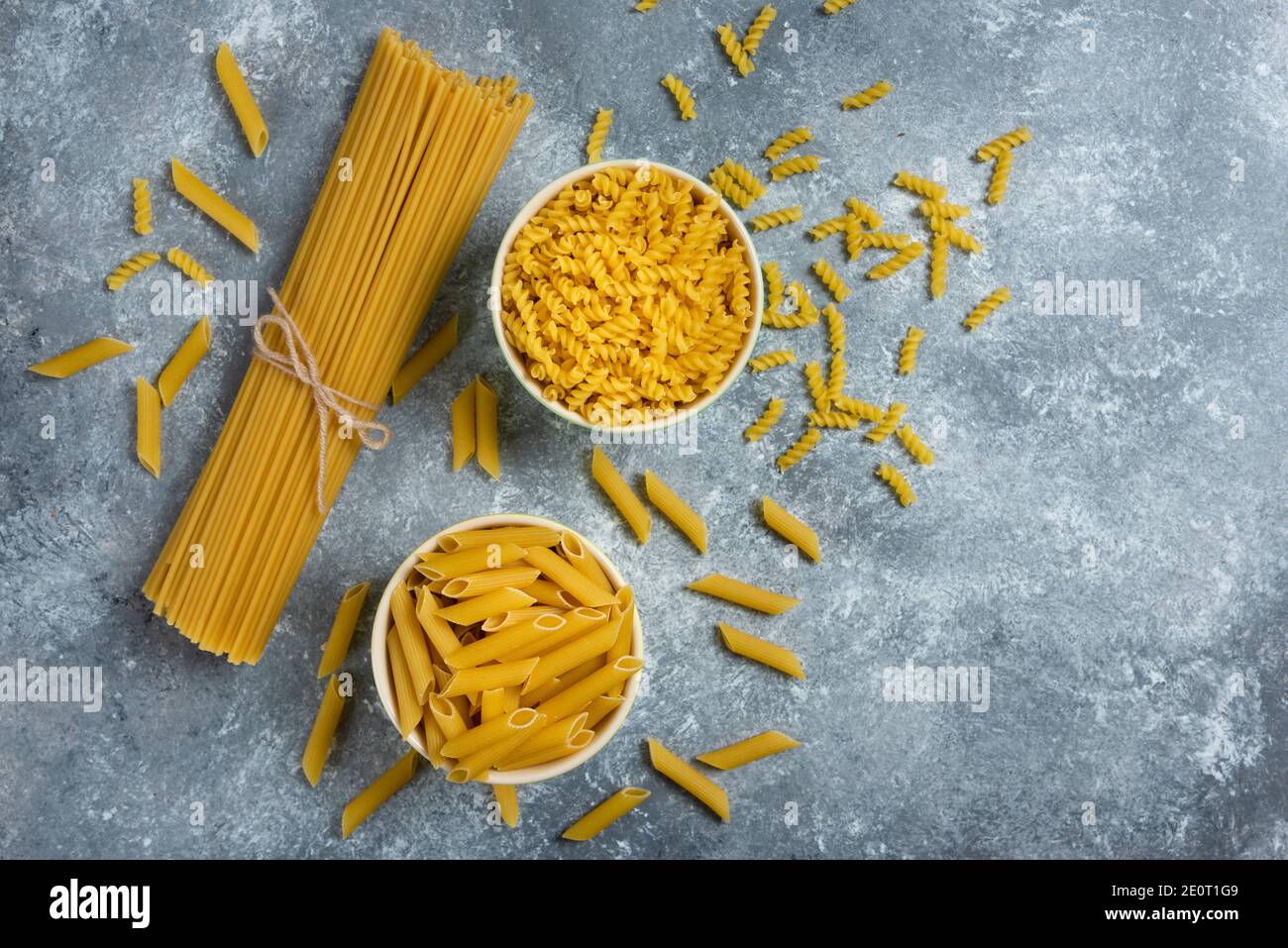 Different types of raw macaroni on a marble background Stock Photo - Alamy