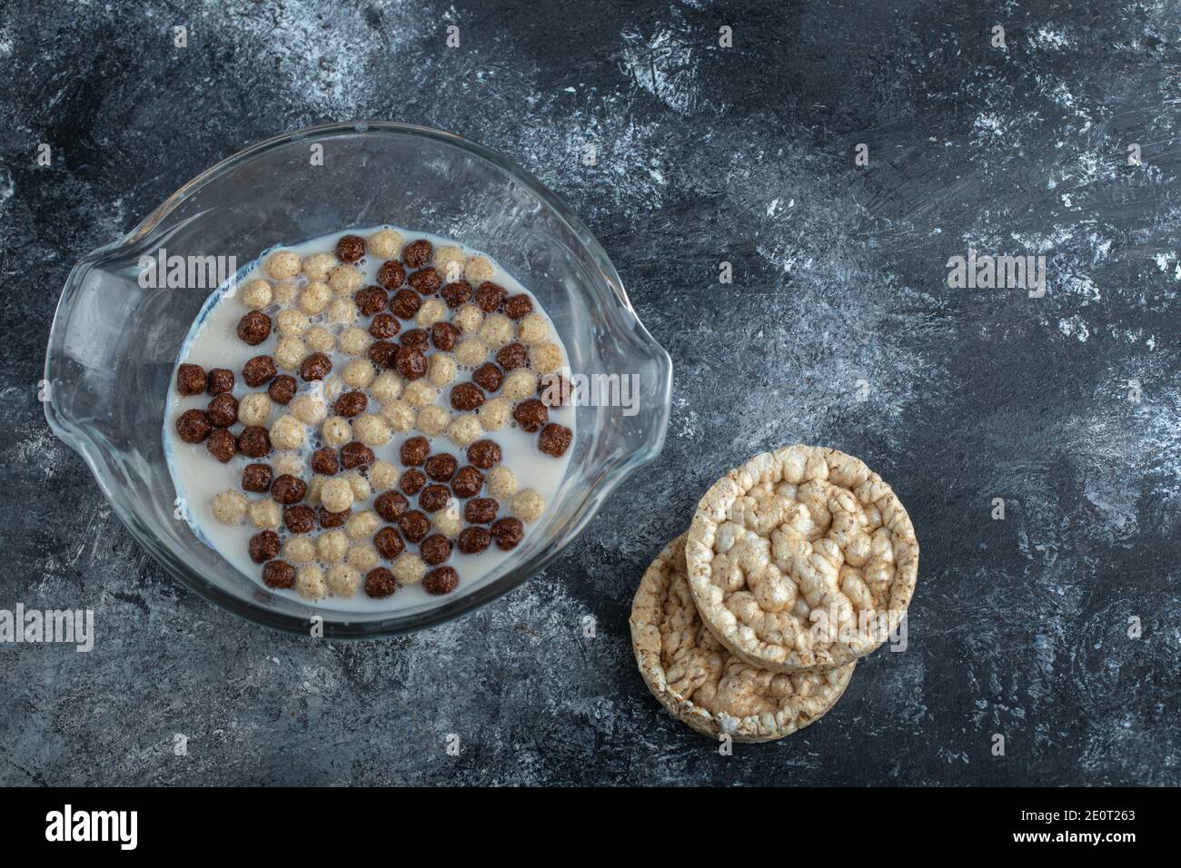 Chocolate and wheat balls in glass bowl with crispbread Stock Photo - Alamy