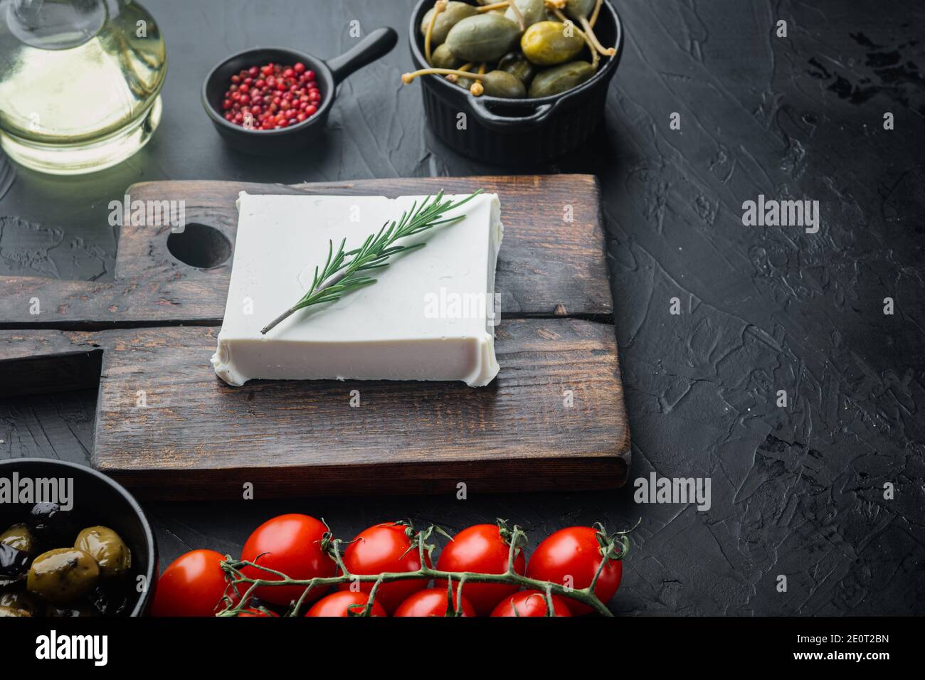 Fresh greek feta cheese set, on black background with copy space for ...