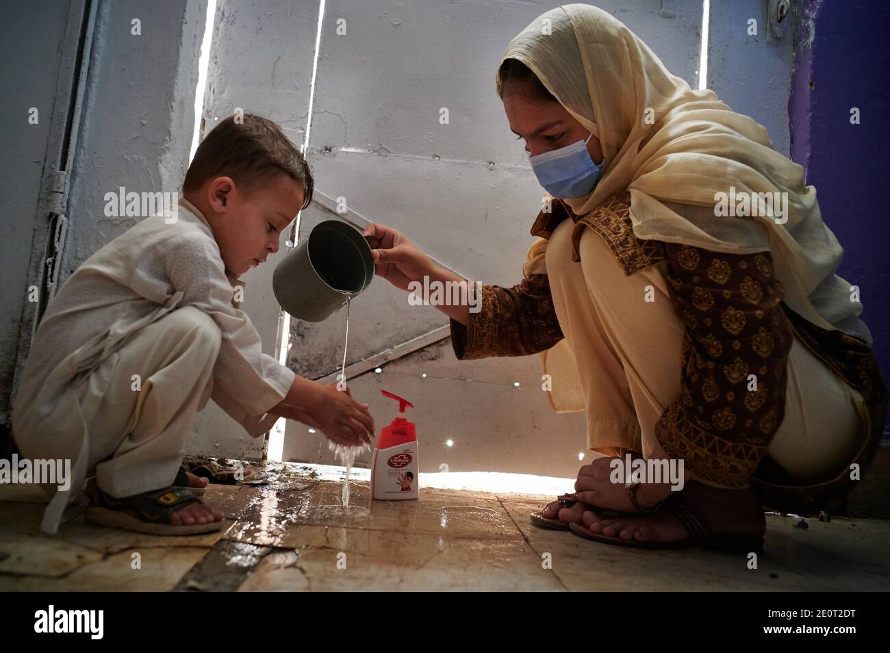 Amidst the coronavirus pandemic, Rahat Rahman, 15, shows her nephew how ...
