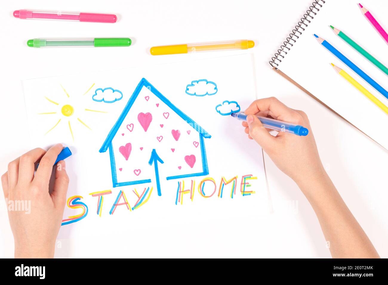 Stay at home. Kid hands drawing picture with house and message Stay ...
