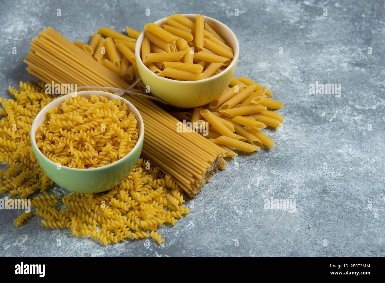 Different types of raw macaroni on a marble background Stock Photo - Alamy