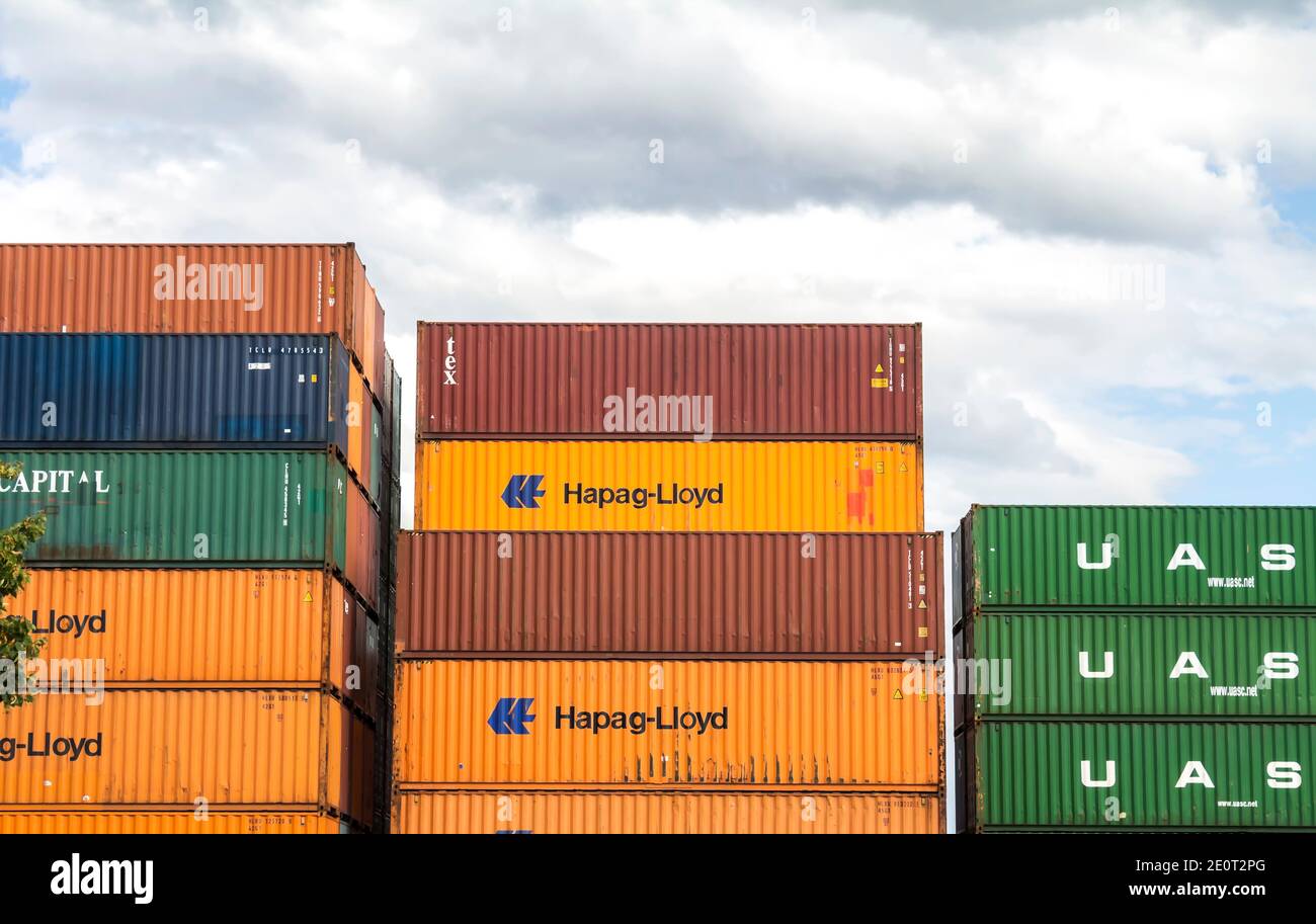 Stacked cargo containers in storage area of freight Stock Photo - Alamy