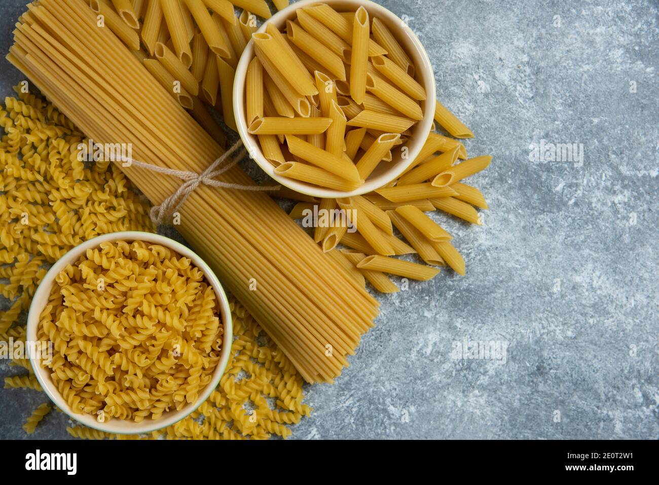 Different types of raw macaroni on a marble background Stock Photo - Alamy