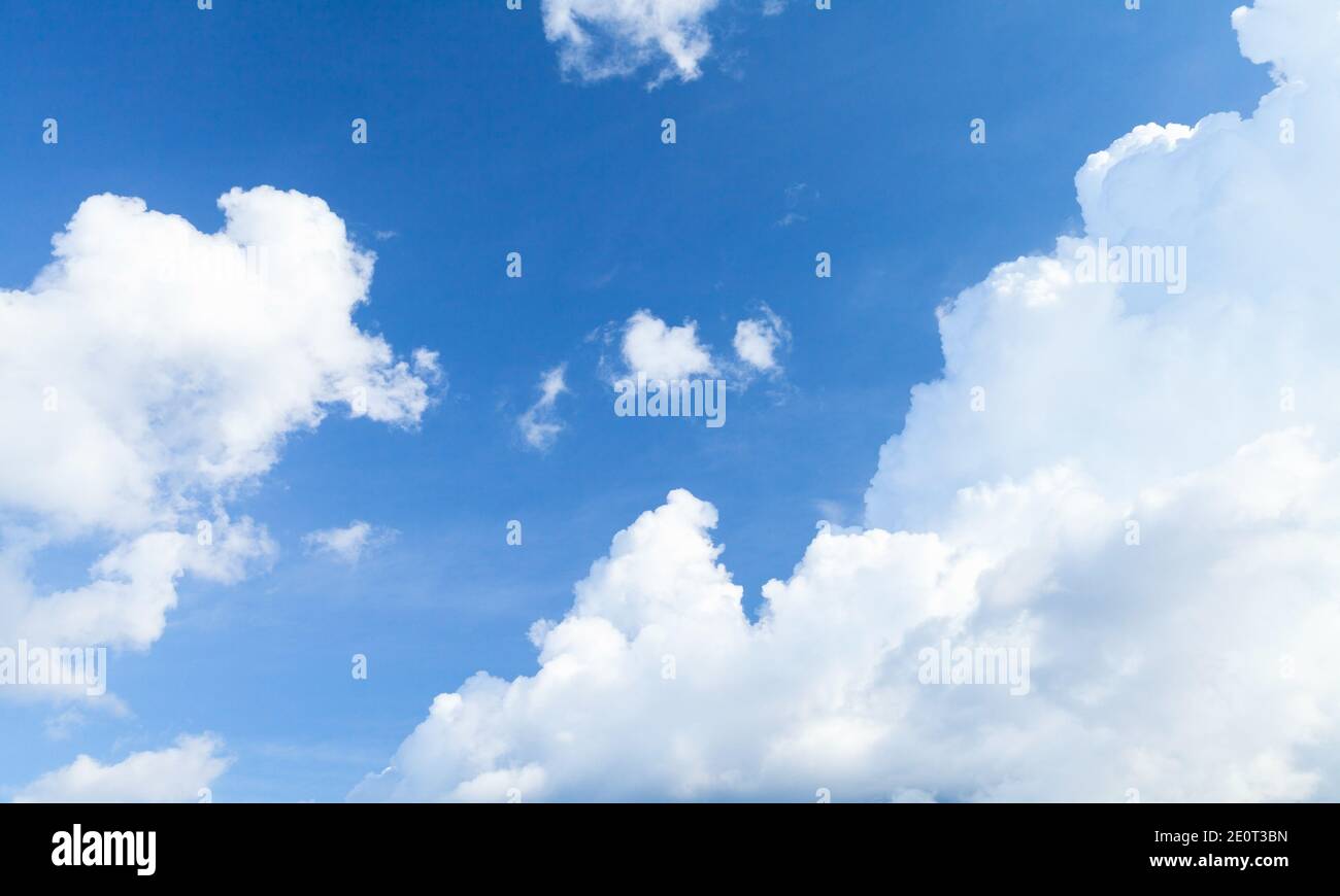 Blue sky with white cumulus clouds at daytime. Natural background photo ...