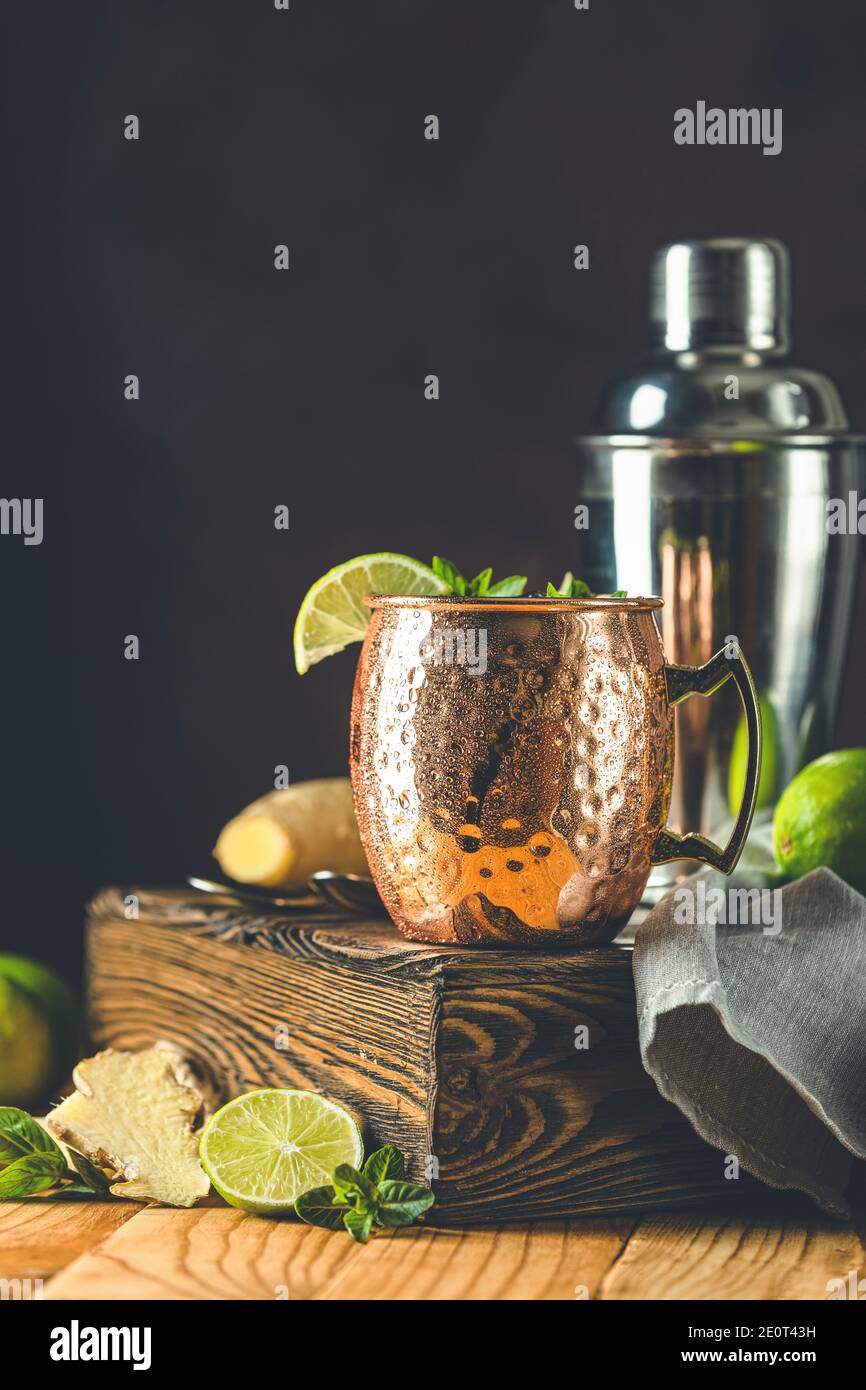 Moscow mule alcoholic cocktail in copper mug with crushed ice, mint and ...