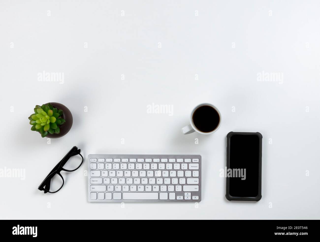 Office desk table with computer keyboard, coffee and smartphone ...