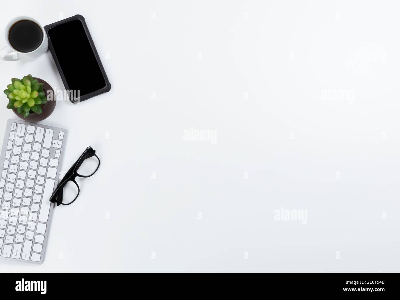 Office desk table with left side border of computer keyboard, coffee ...