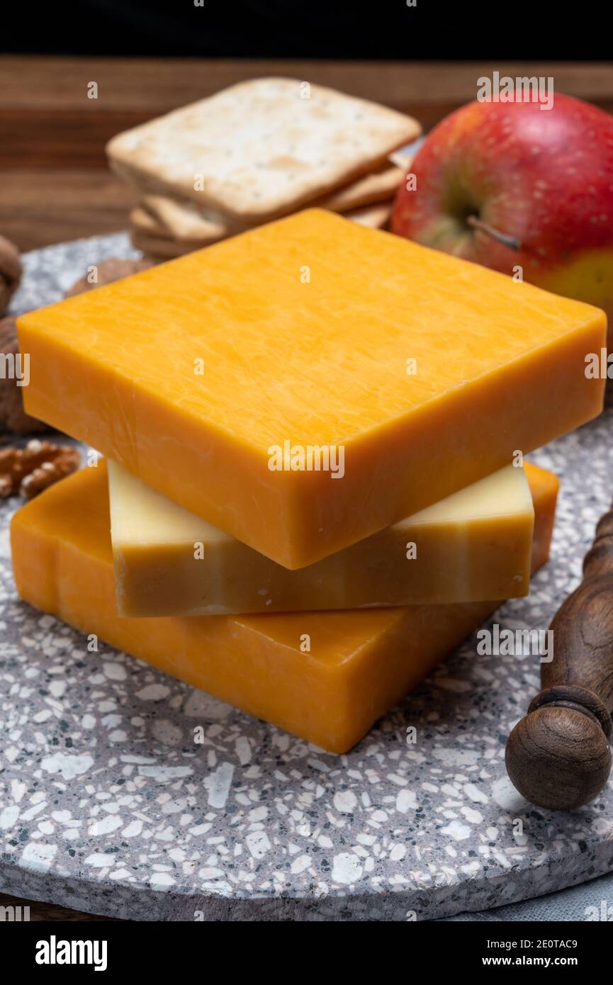 Cheese collection, orange and yellow smoked British cheese from England ...