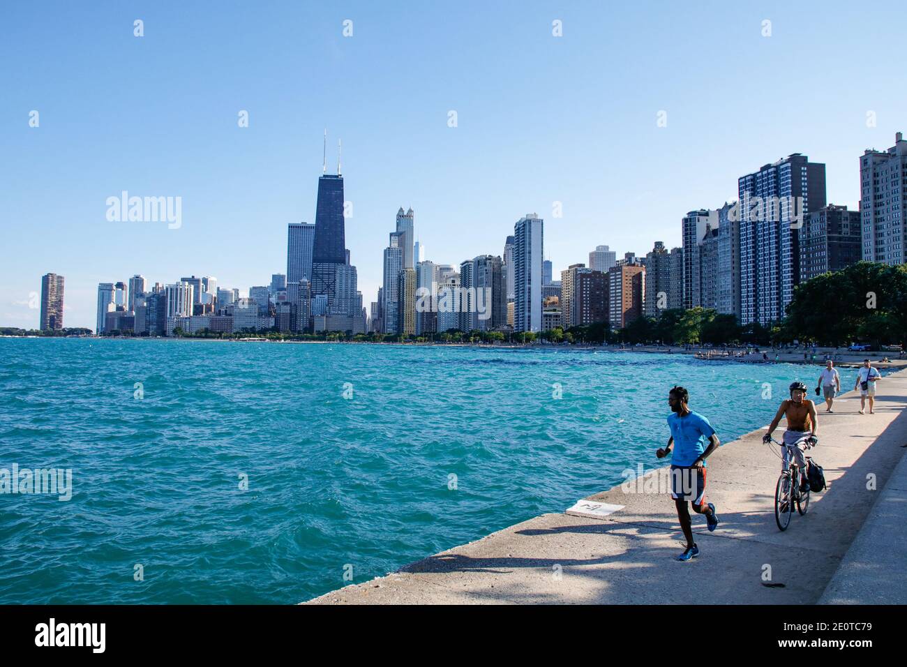 Chicago lakefront near North Avenue Beach. Runner and cyclist Stock ...
