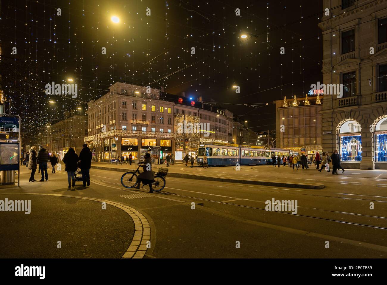 Traffic at illuminated Paradeplatz at christmastime at night ...