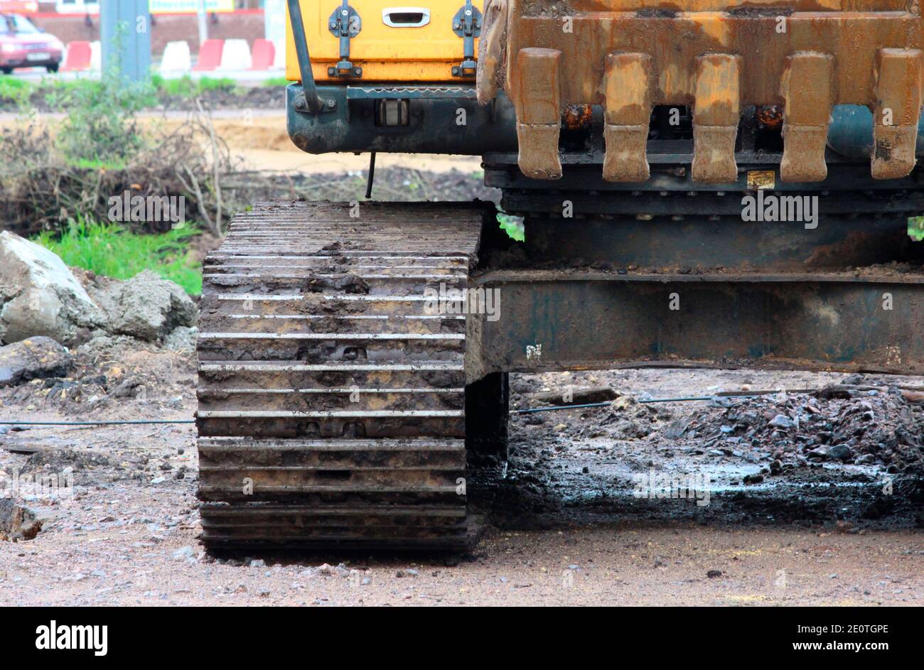 excavator tracks in the water. repair and expansion of a road in the ...