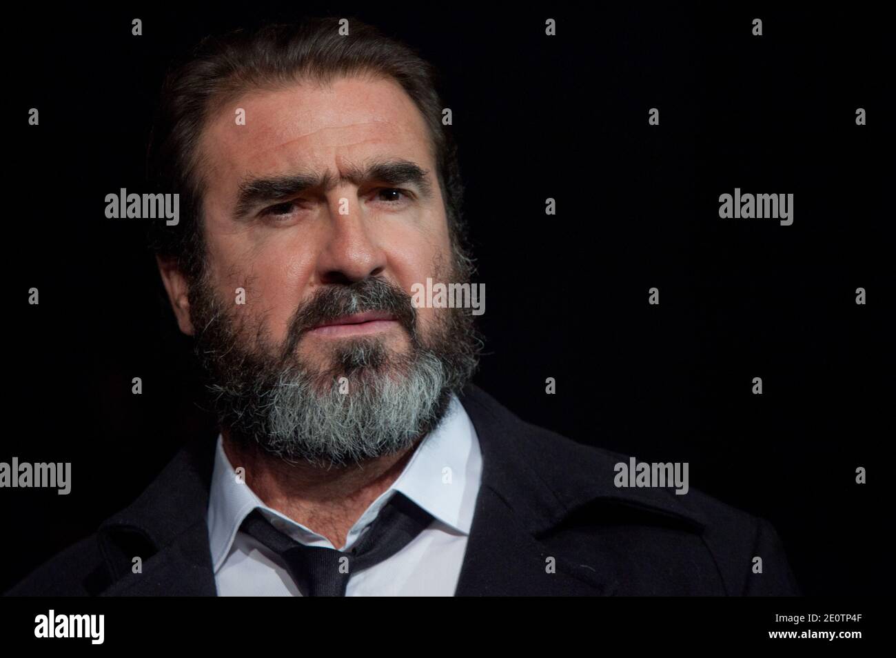 Former footballer turned actor Eric Cantona poses at a ceremony ...