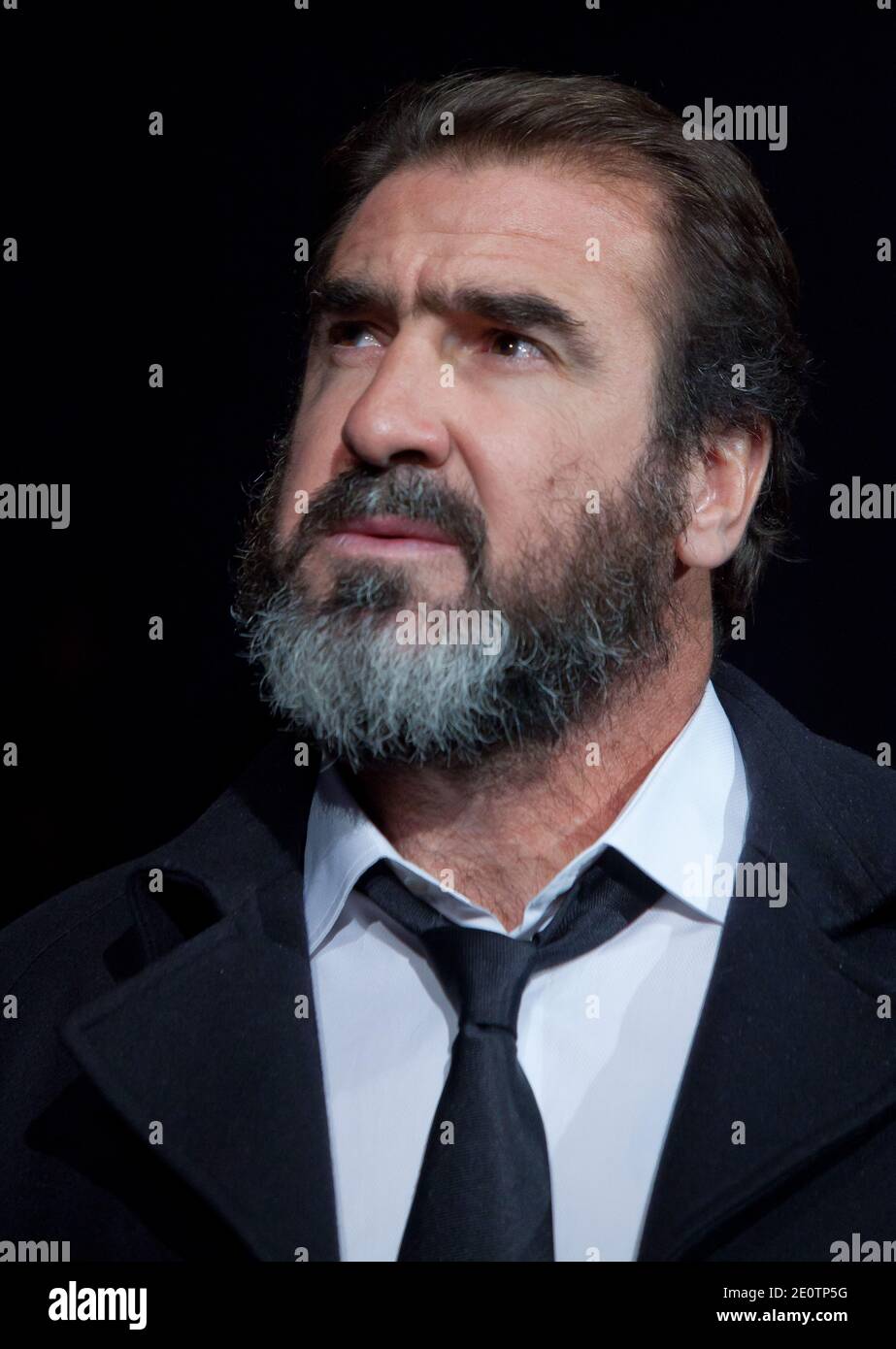 Former footballer turned actor Eric Cantona poses at a ceremony ...