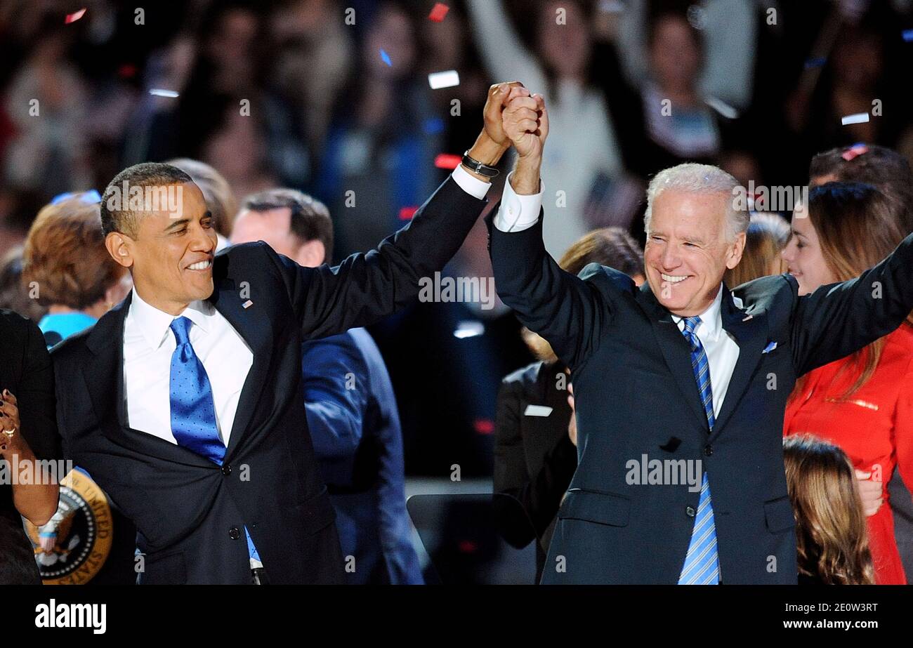 U.S. President Barack Obama and Vice President Joe Biden wave on stage ...