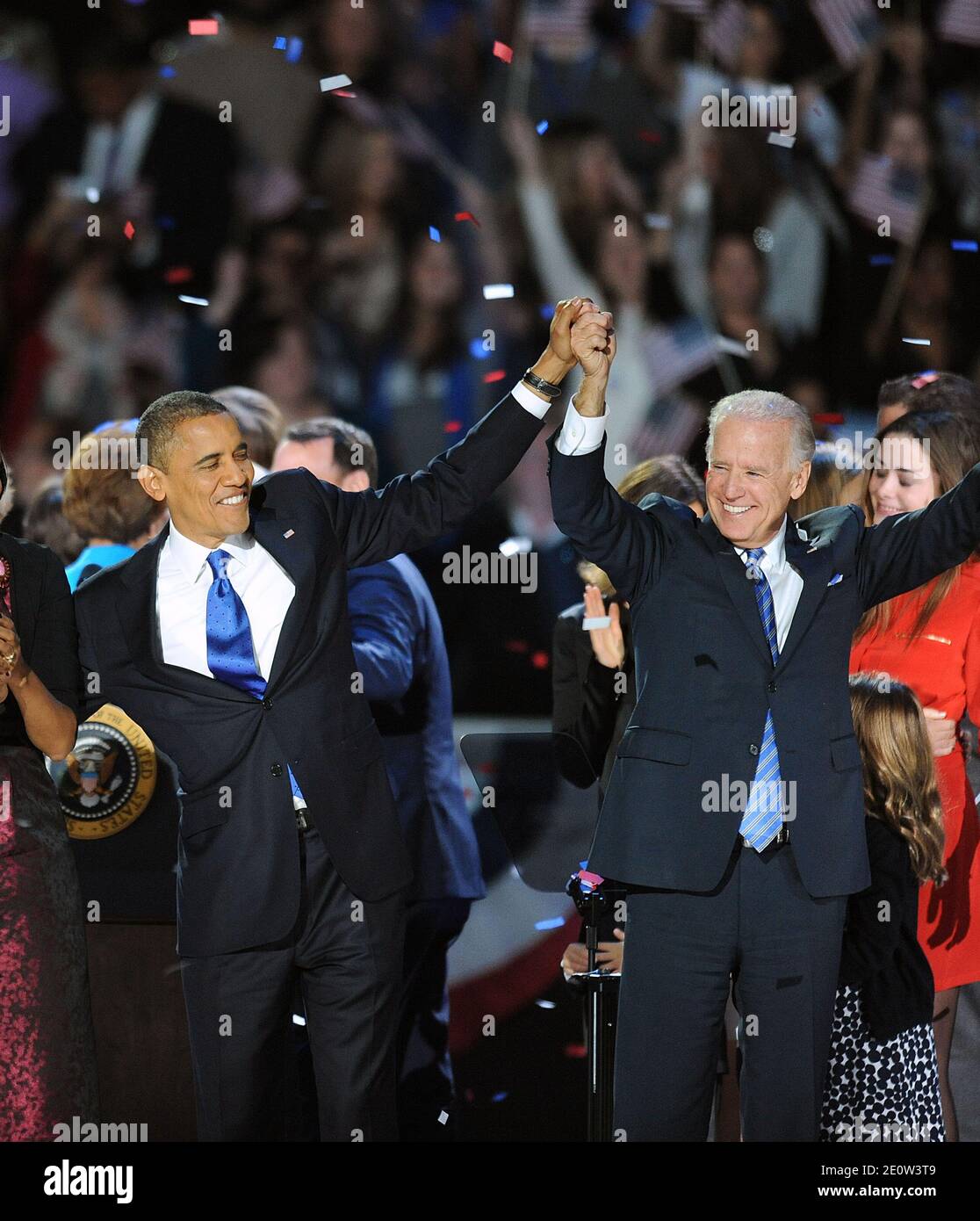 U.S. President Barack Obama and Vice President Joe Biden wave on stage ...