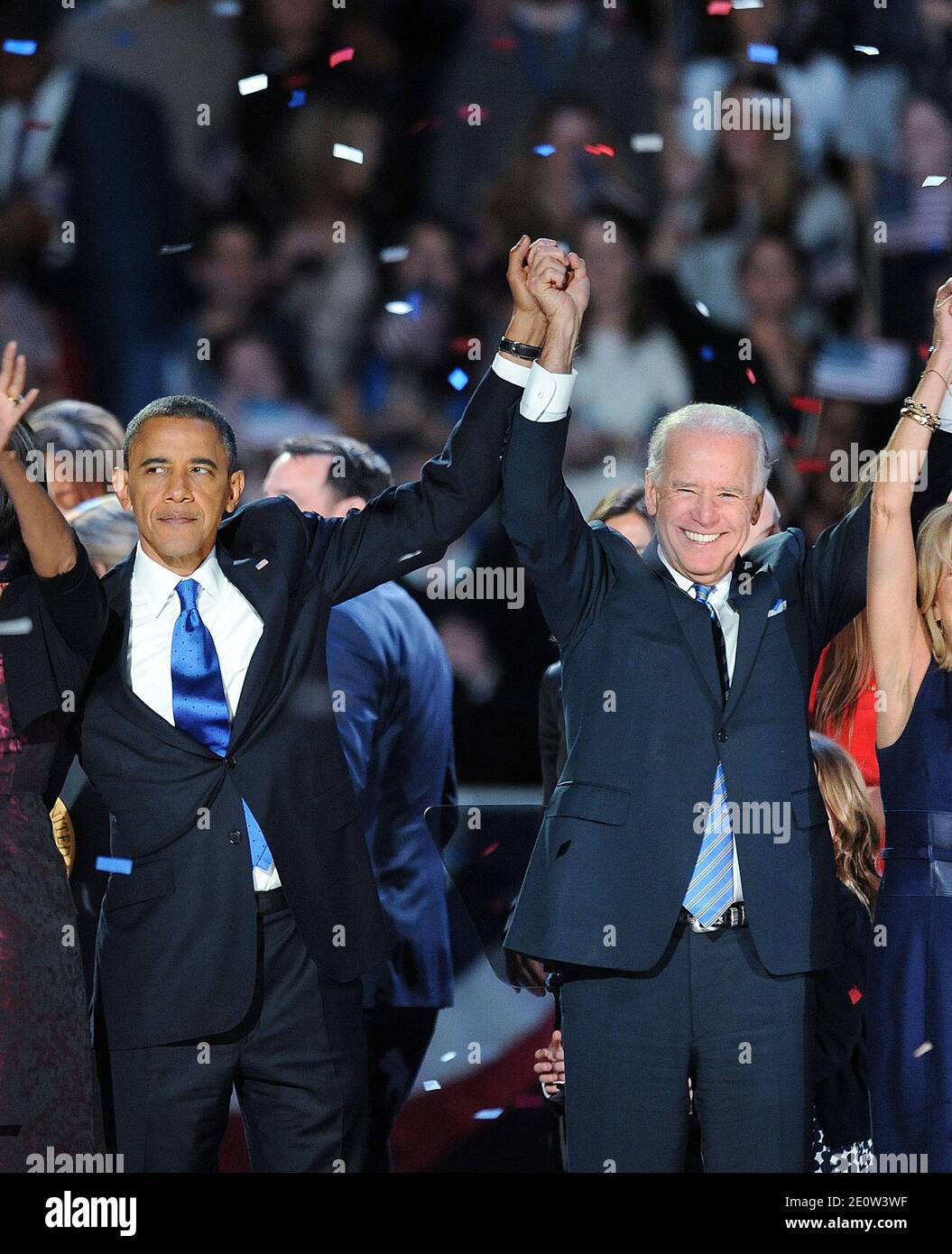 U.S. President Barack Obama and Vice President Joe Biden wave on stage ...