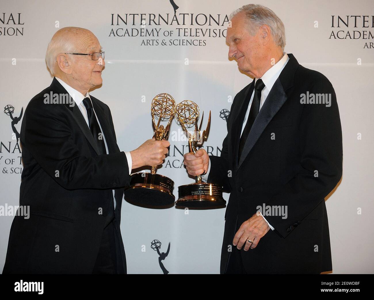 Norman Lear and Alan Alda posing backstage in the press room during the ...