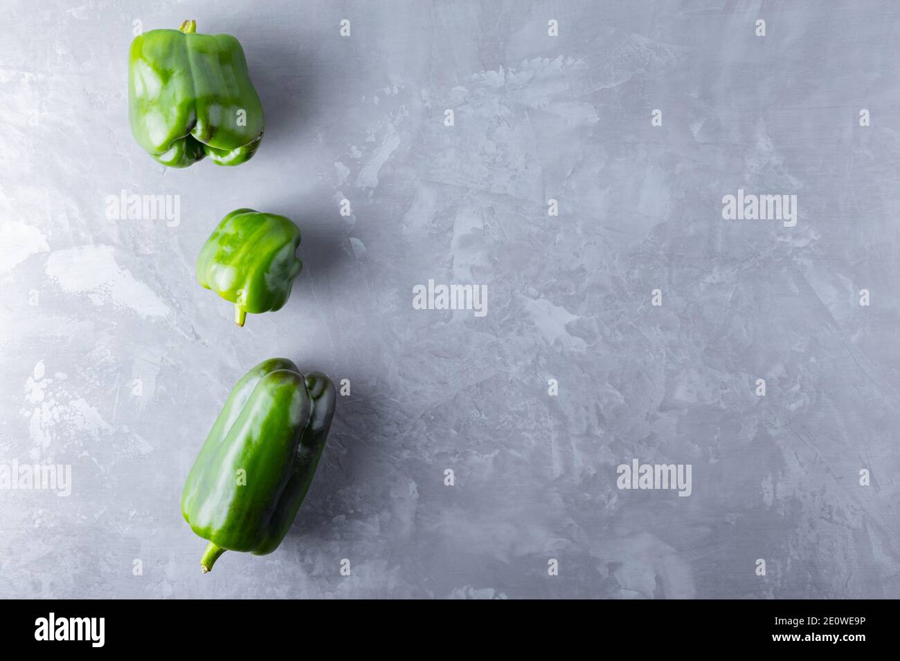 Ugly bell pepper on ultimate gray background. Deformed homegrown green ...