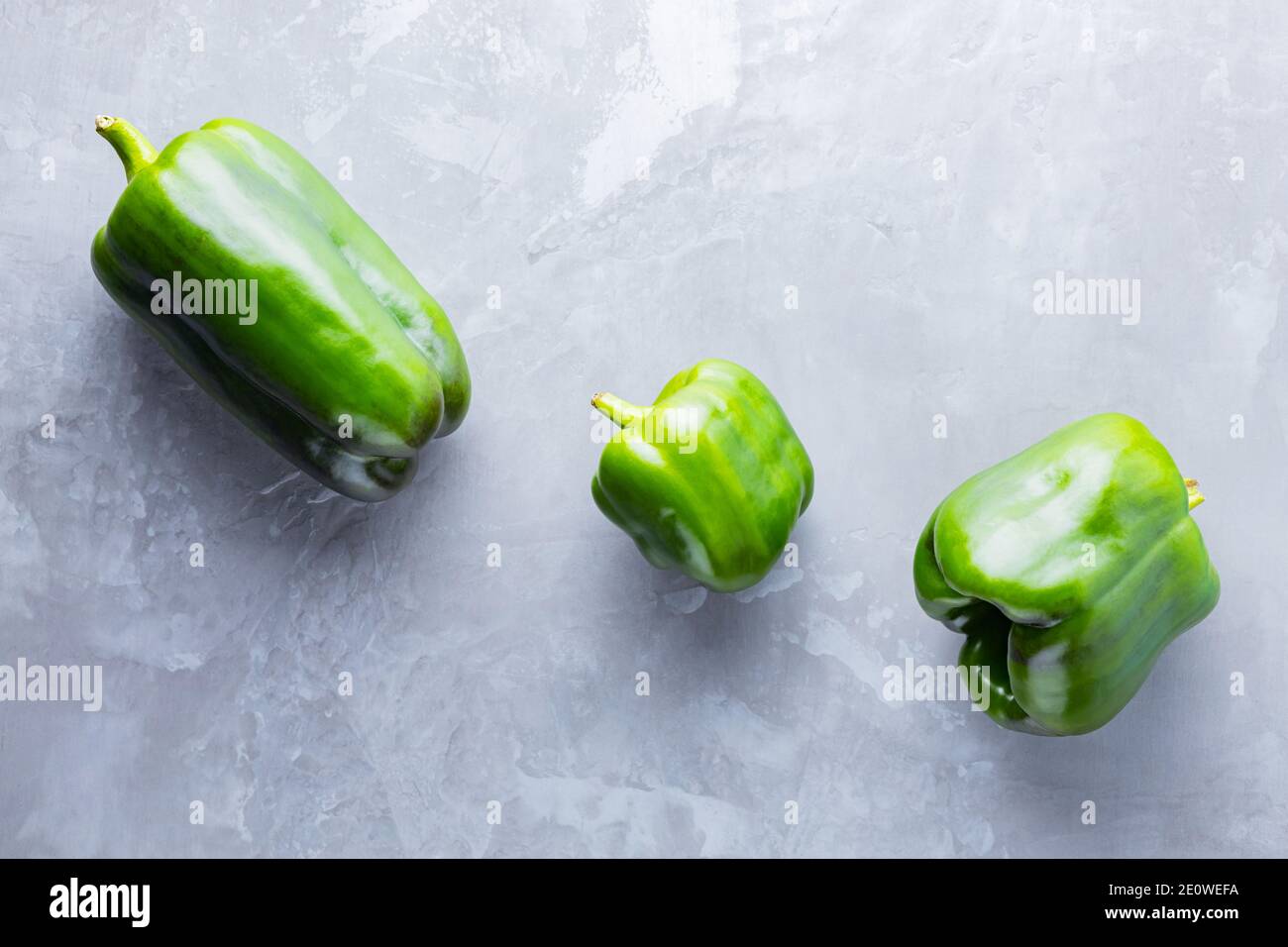 Ugly bell pepper on ultimate gray background. Deformed homegrown green ...