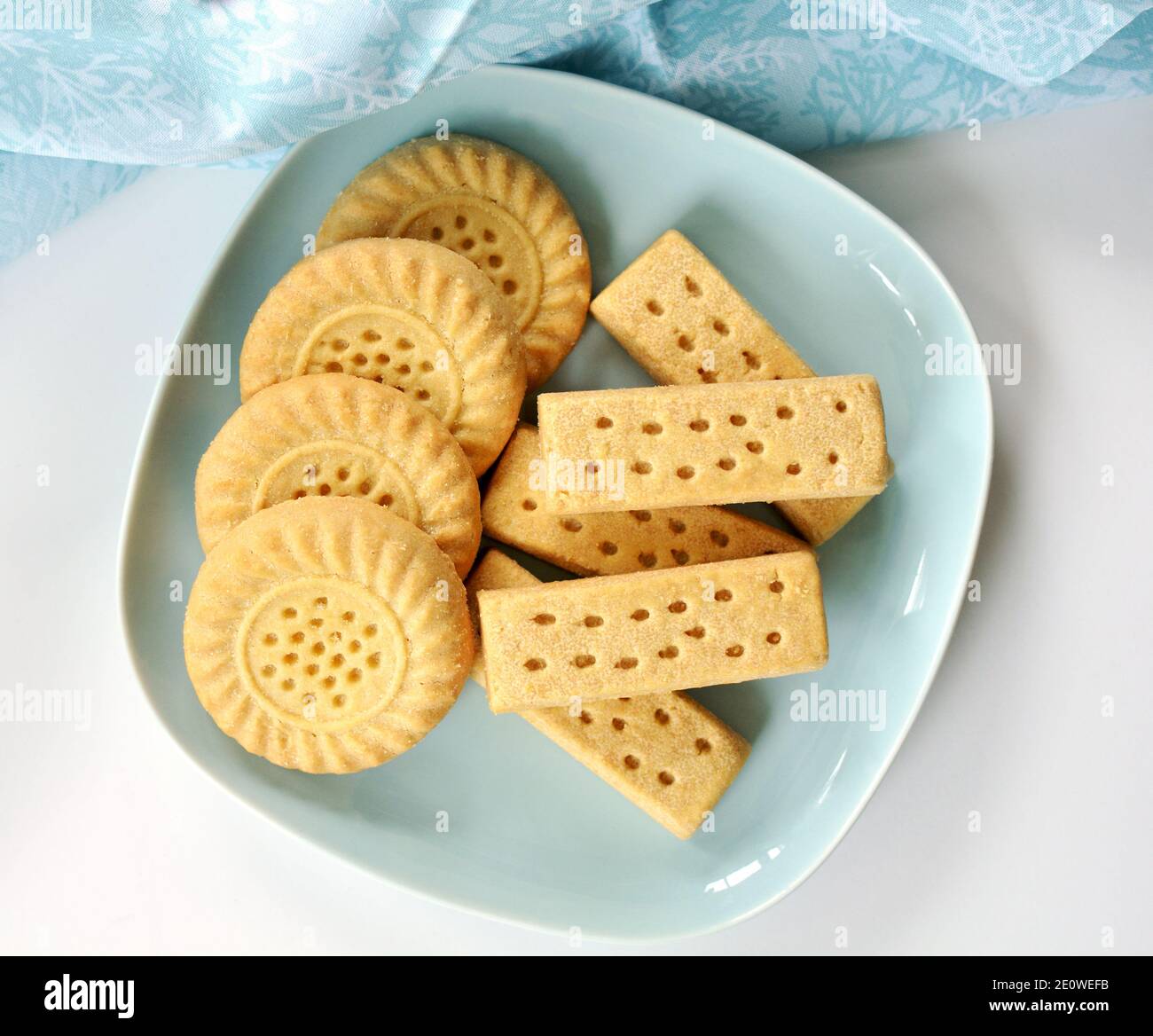 Scottish shortbread cookies on pale blue plate in horizontal format ...