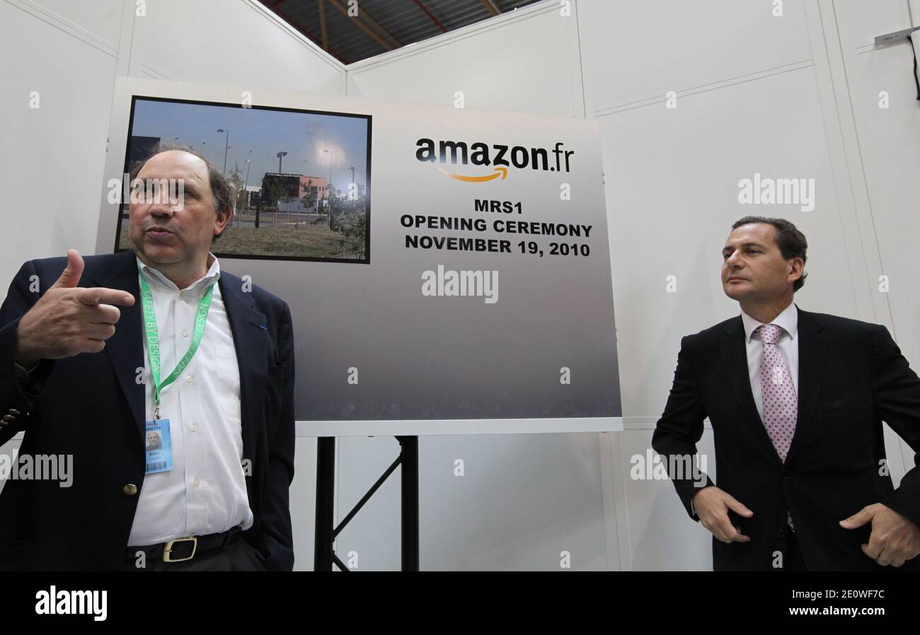 French Minister of Industry Eric Besson and Amazon vice chairman Marc ...