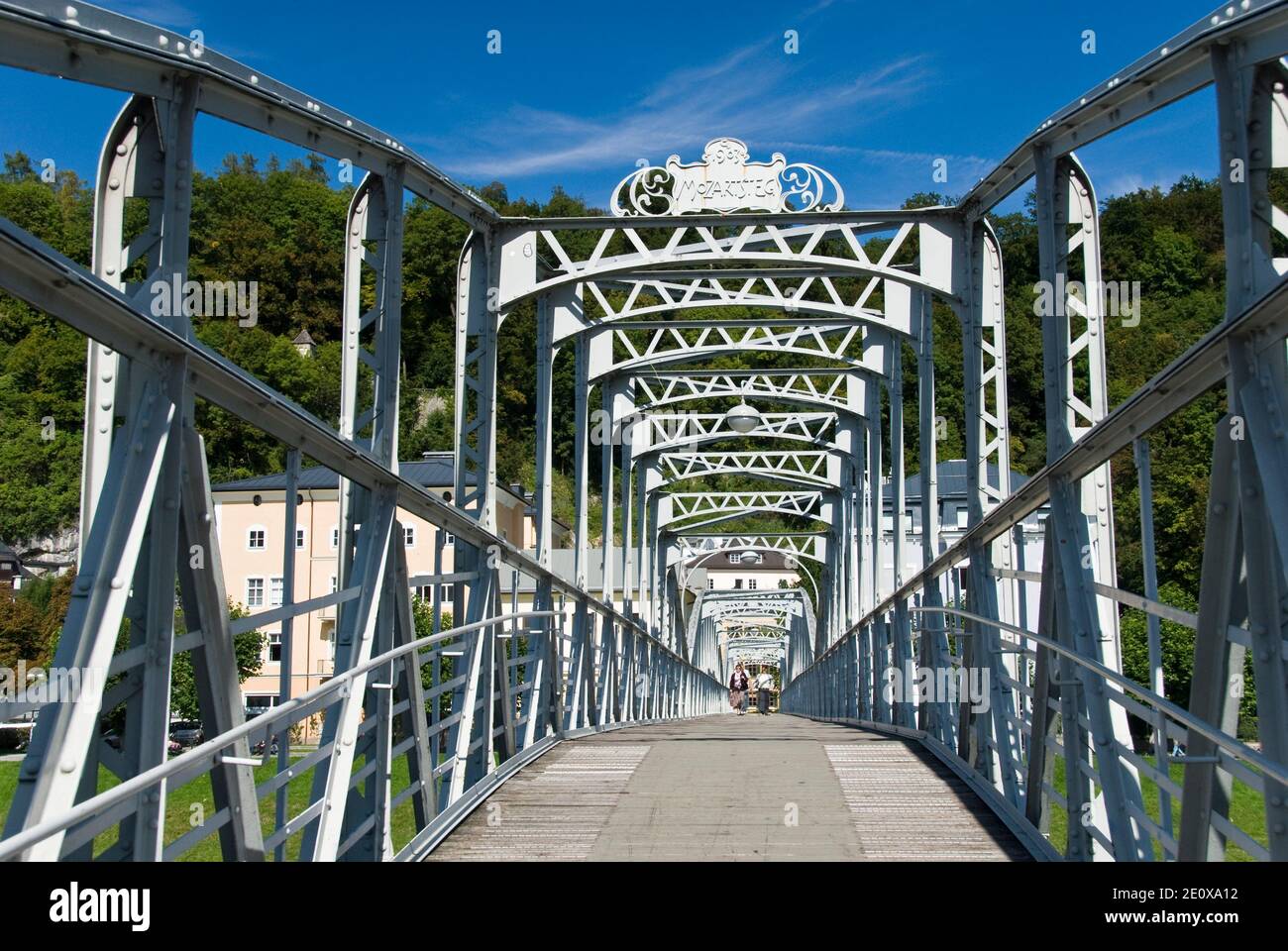 The 1903 Mozartsteg foot bridge crosses the Salzach river at Salzburg ...